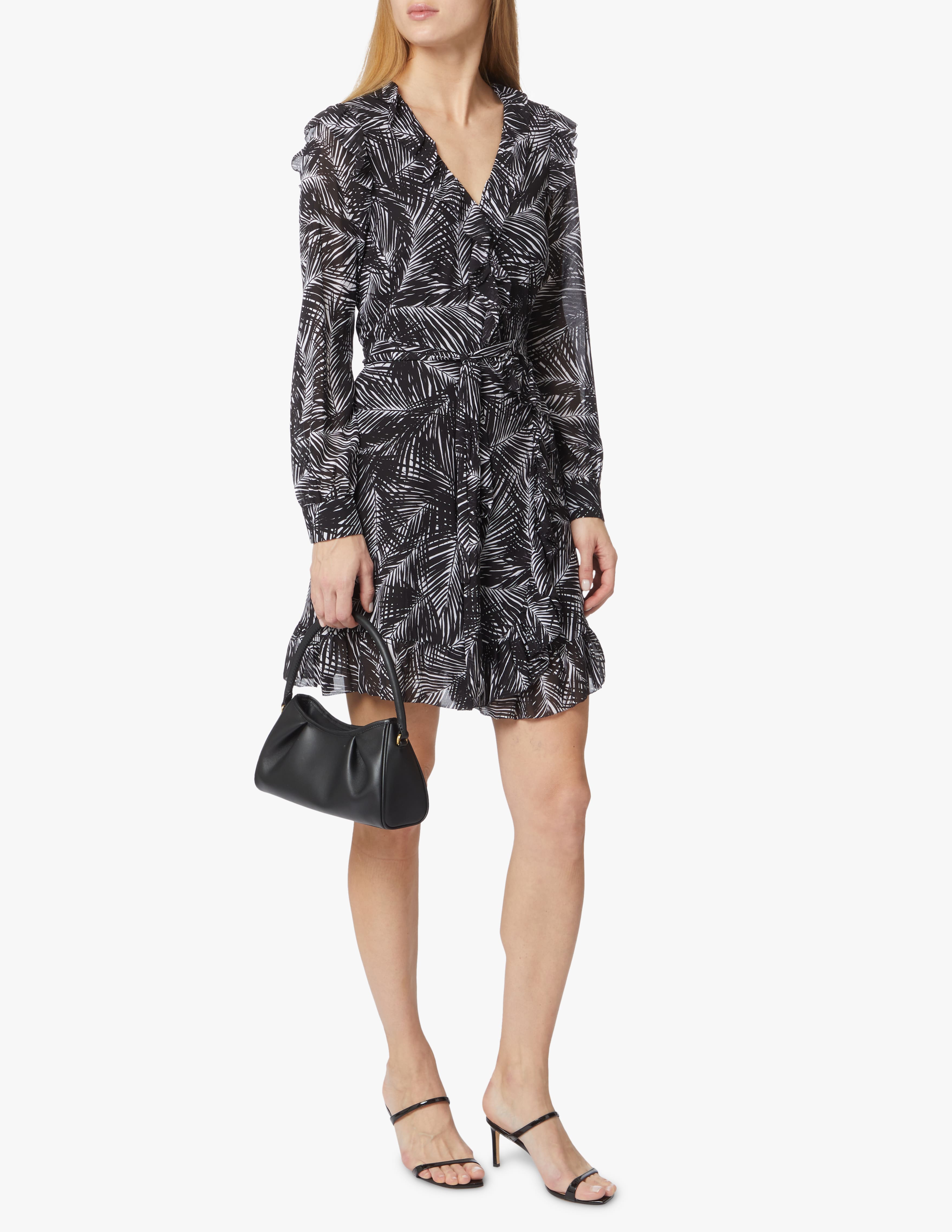Shop Michael Michael Kors Long sleeved wrap mini dress - black on ...