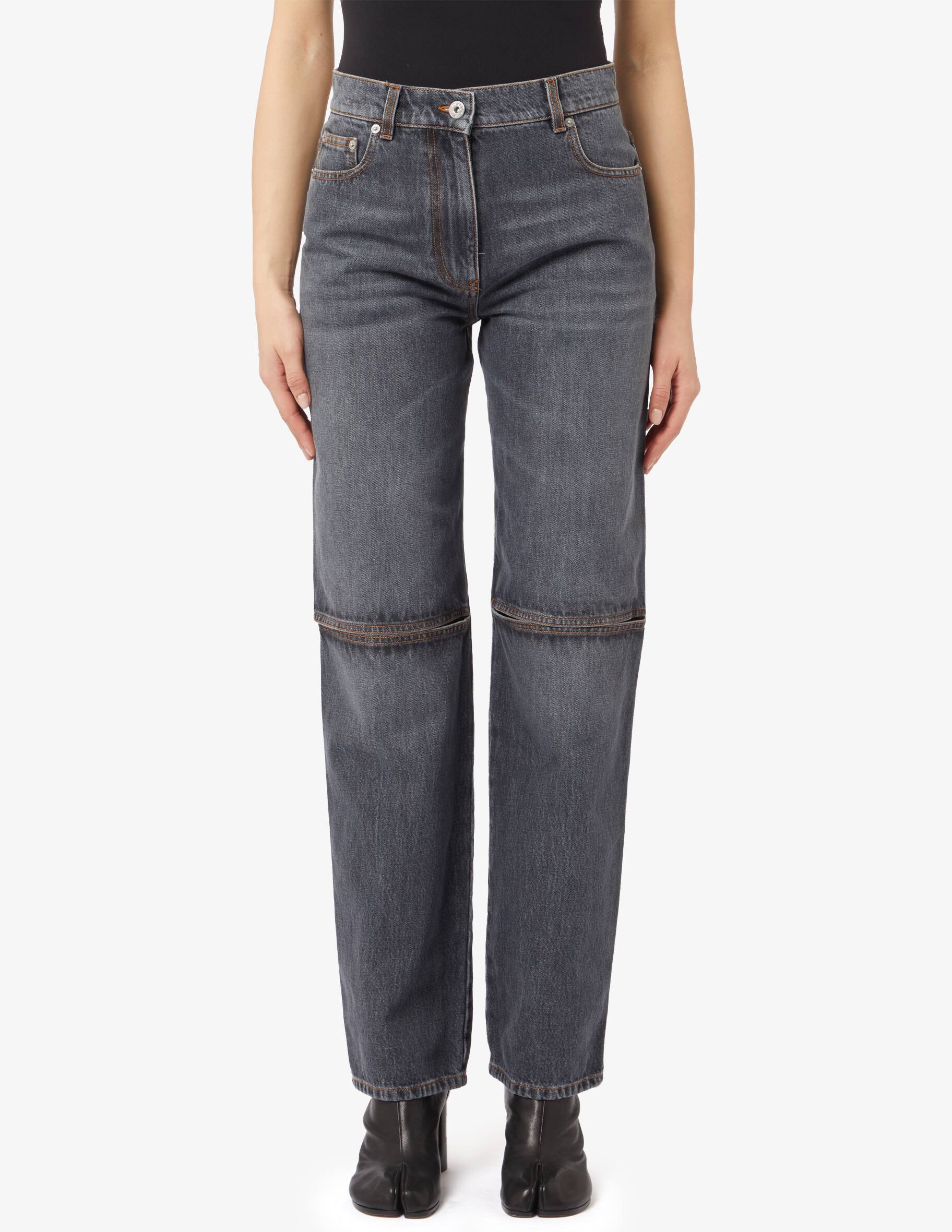 Shop JW Anderson Jeans with cut-out on Rinascente