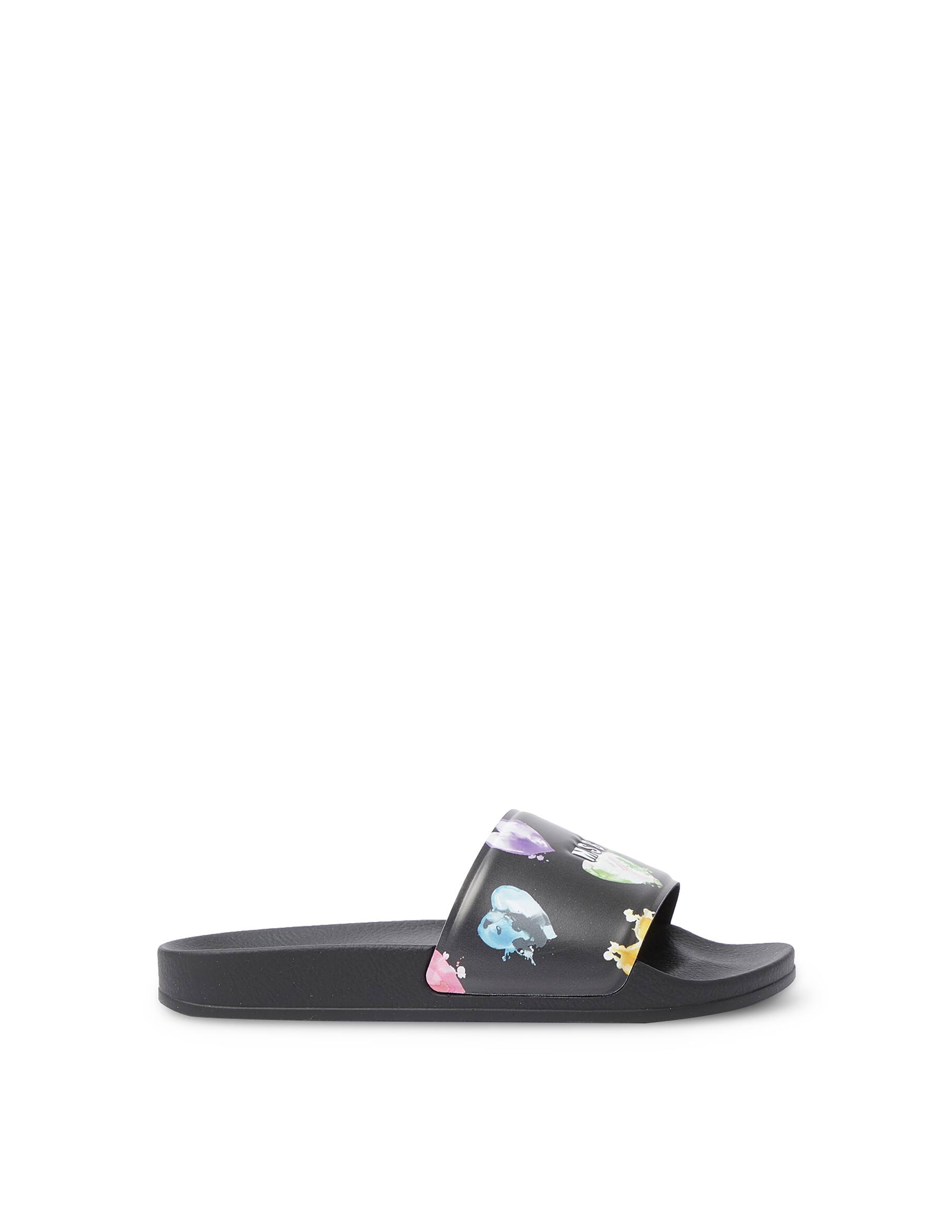 Shop MSGM Logo rubber slides - black on Rinascente