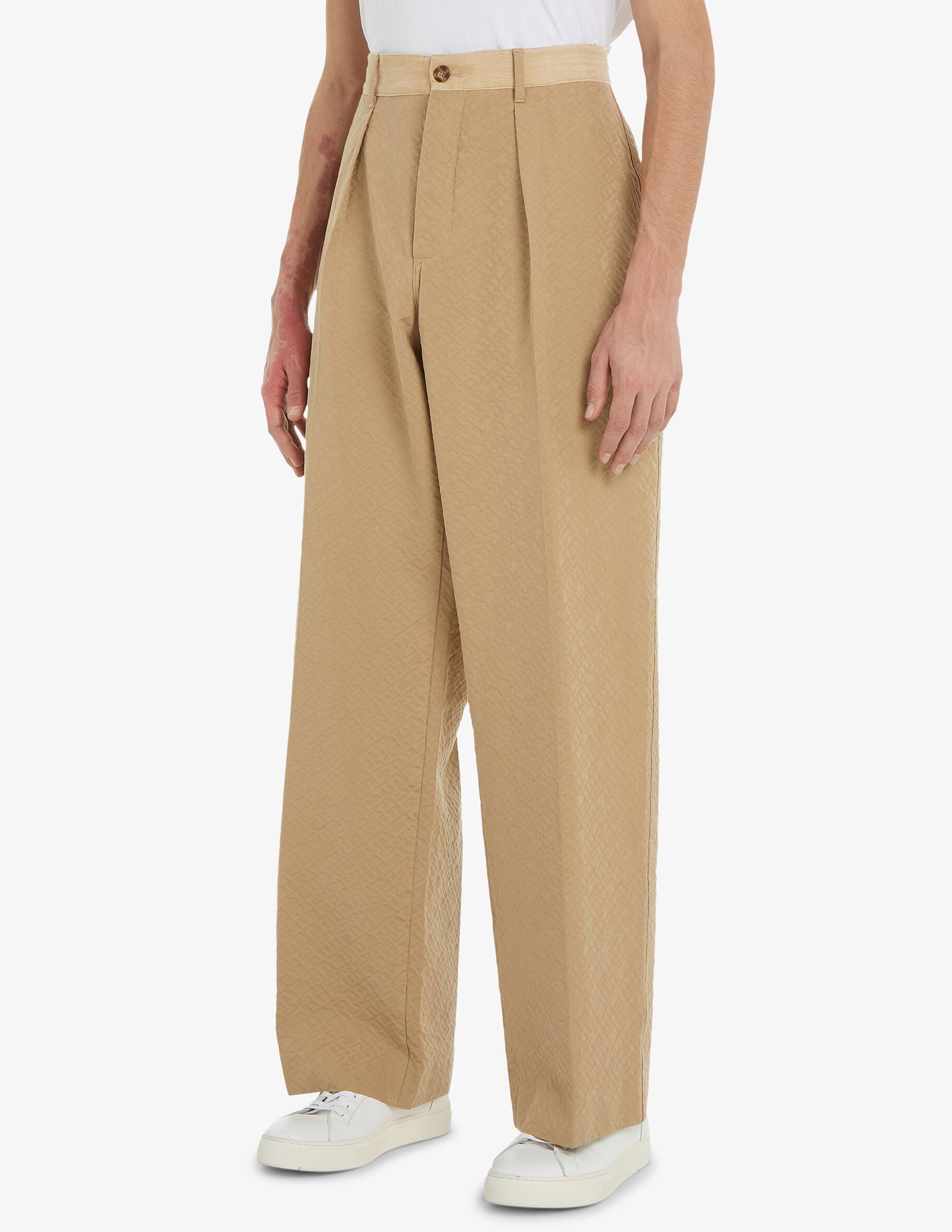 Shop Tommy Hilfiger Chino monogram trousers on Rinascente